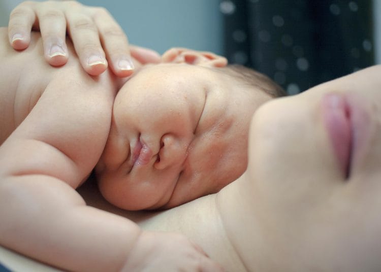 How Long to Keep Baby Upright After Feeding? - Newborn Stages